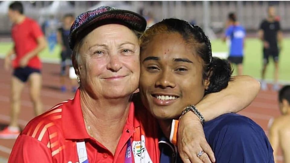 Who has coached Hima Das to sprinting success?