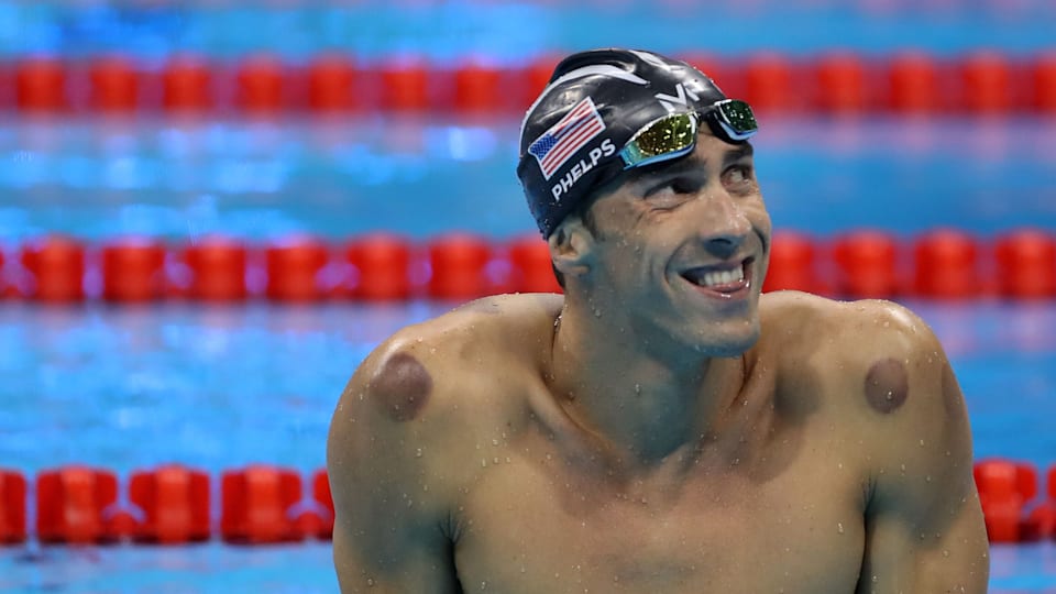 Who comes closest to Michael Phelps' medal count?