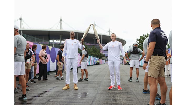 The Olympic torch blazes from Saint-Denis to Paris in a spectacular ...