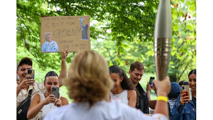 The Olympic torch blazes from Saint-Denis to Paris in a spectacular ...