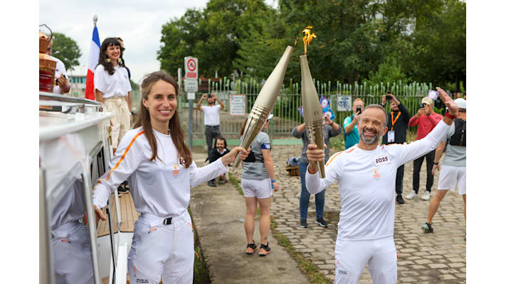 The Olympic torch blazes from Saint-Denis to Paris in a spectacular ...