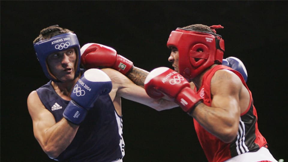 Ward honours father with boxing gold - Olympic News
