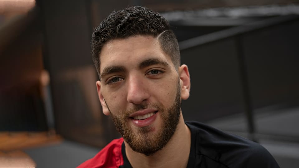 Refugee shuttler Aram Mahmoud loses Tokyo opener to Jonatan Christie