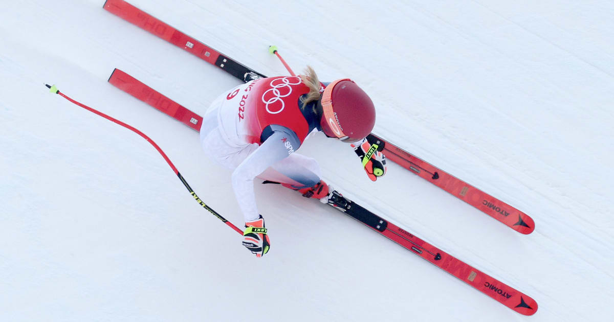 Why are alpine ski poles for speed disciplines curved?