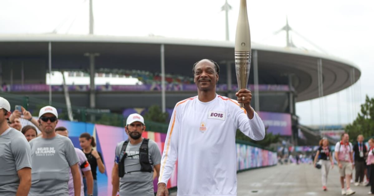 The Olympic torch blazes from Saint-Denis to Paris in a spectacular ...