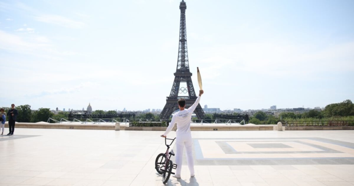 Parisians give the Olympic Torch Relay a historic welcome with the ...