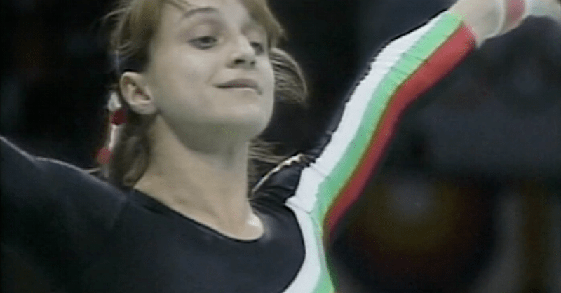 Team Bulgaria performs its optional routines on the uneven bars at the ...